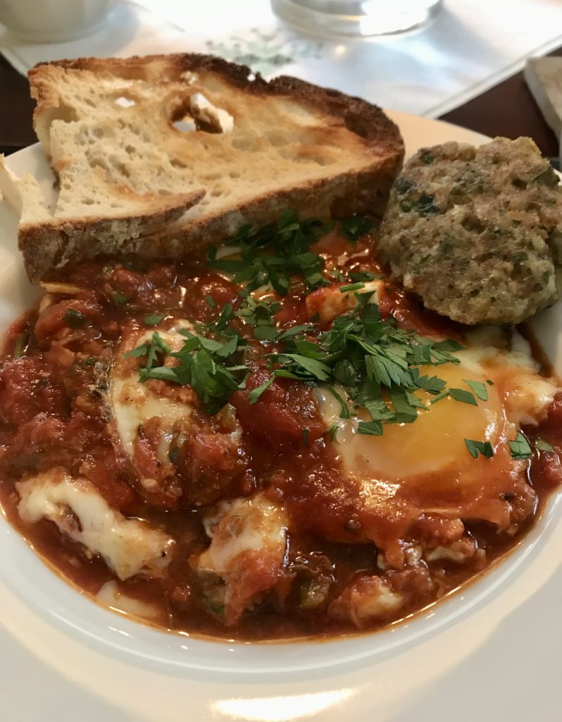 Shakshuka serving with sausage and bread - LOVE-the secret ingredient
